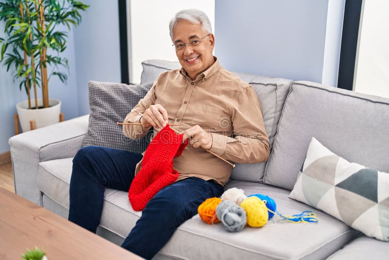 Senior Man Sitting on Sofa Sewing at Home Stock Image - Image of adult ...