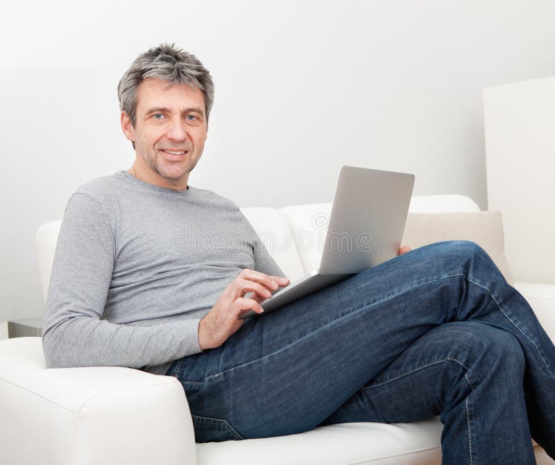 Senior Man Sitting in Sofa and Using Laptop Stock Image - Image of ...