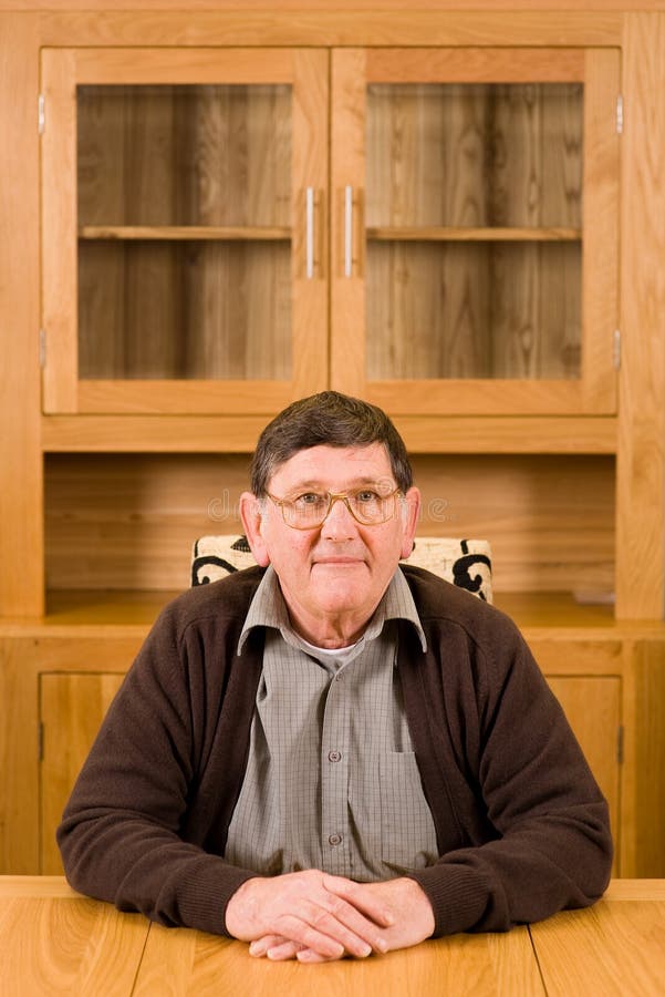 Senior Man Sitting at Table with Copyspace Above Stock Photo - Image of ...