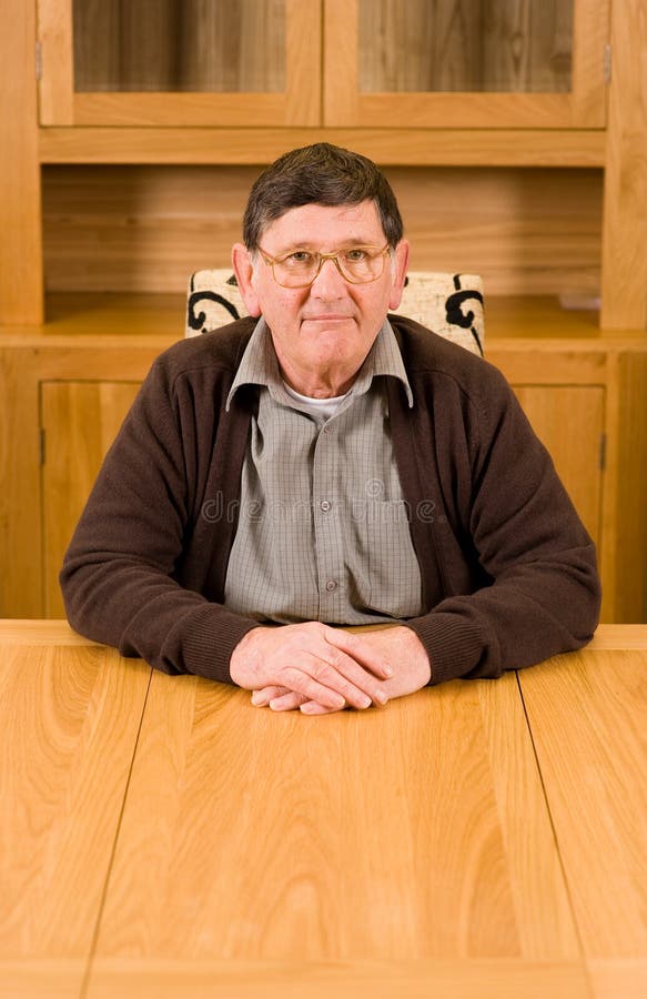 Senior Man Sitting at Table with Copyspace Below Stock Image - Image of ...