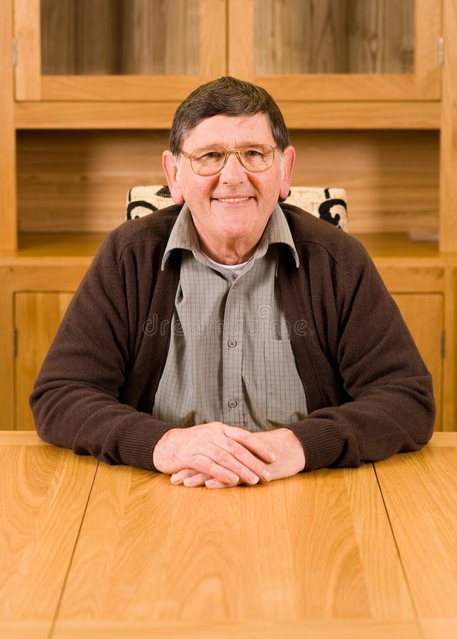 Senior Man Sitting at Table with Copyspace Below Stock Image - Image of ...