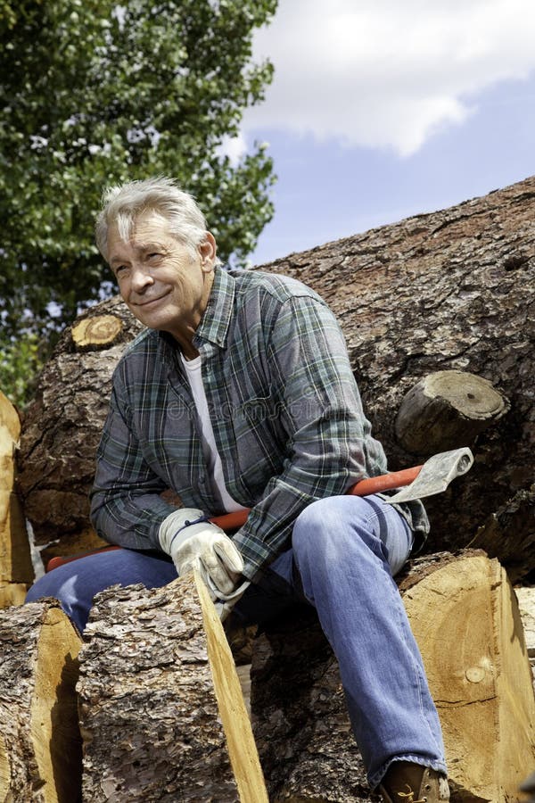 Senior Man Cutting Tree Stump with Chainsaw Stock Image - Image of ...
