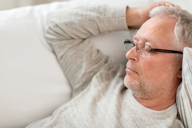 Senior Man Sleeping on Sofa at Home Stock Image - Image of elderly ...