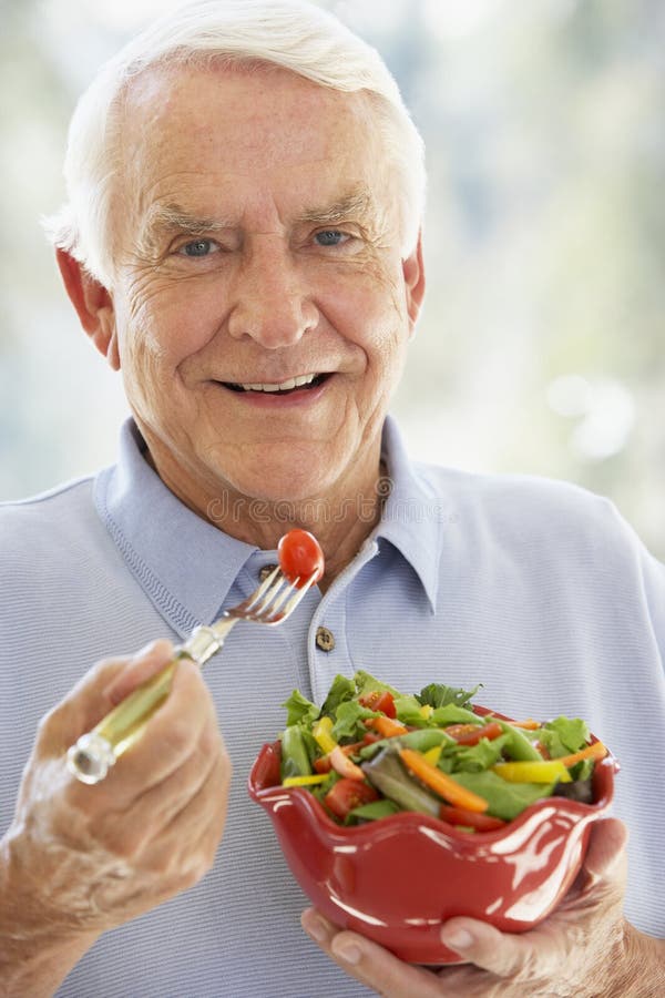 Senior Man Smiling at Camera and Eating Salad Stock Image - Image of ...