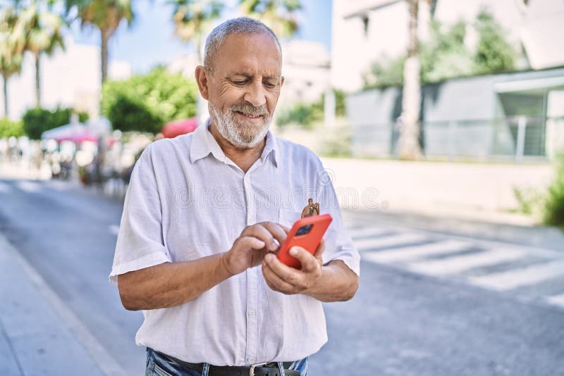 Senior Man Smiling Confident Using Smartphone at Street Stock Image ...