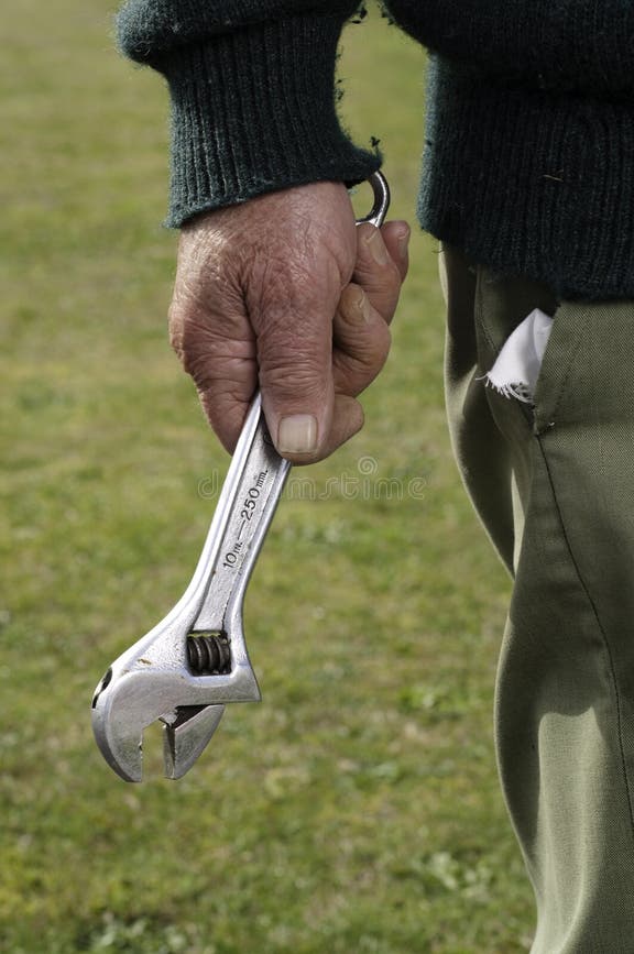 Senior man with spanner stock image. Image of male, person - 10698083