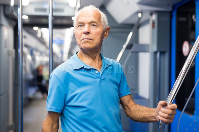 Senior Man Standing Inside Subway Train Stock Image - Image of elder ...