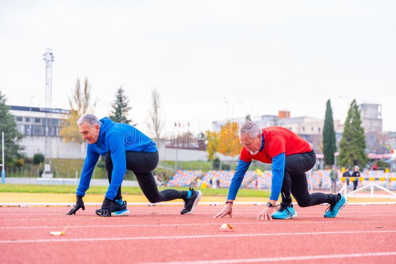 Senior Man in Starting Pose in a Running Athletic Track Stock Photo ...
