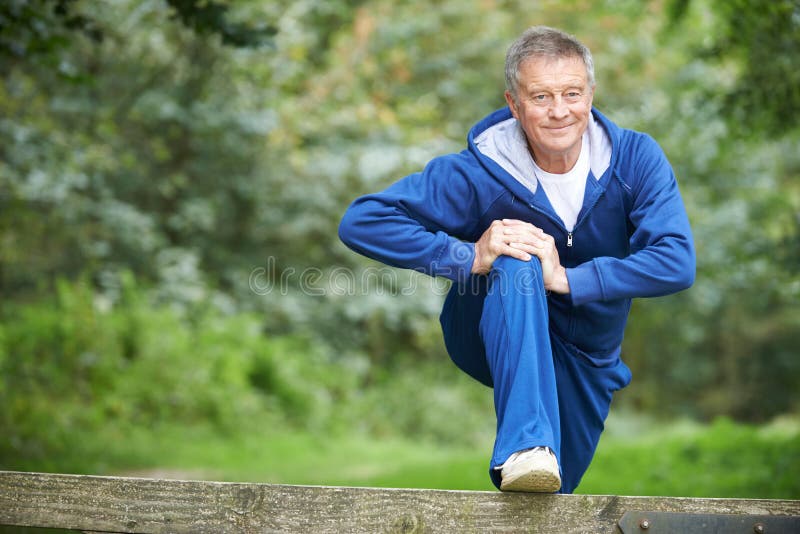 Senior Man Stretching on Countryside Run Stock Image - Image of ...