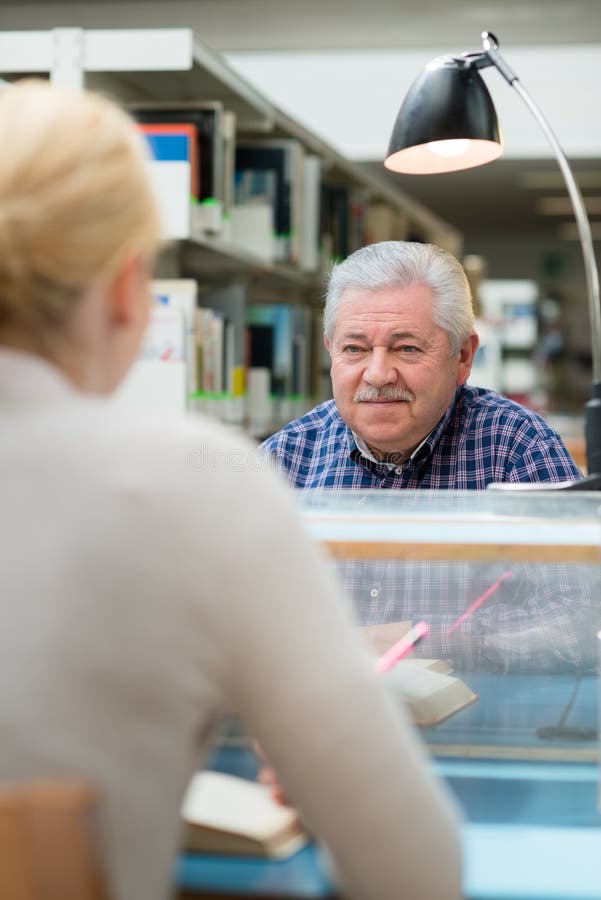 Senior Man Studying among Young People in Library Stock Photo - Image ...