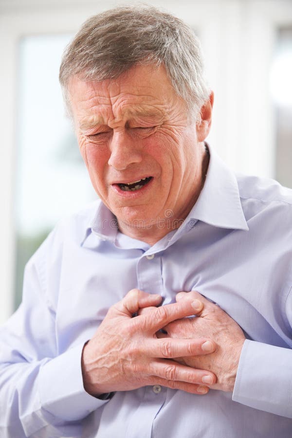 Senior Man Suffering Heart Attack at Home Stock Photo - Image of ...