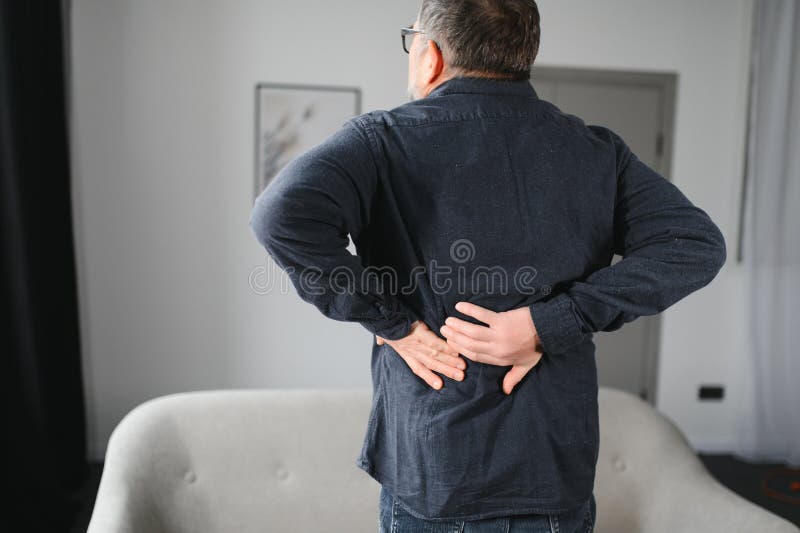 Senior Man is Suffering from Pain in Lower Back at Home Stock Image ...