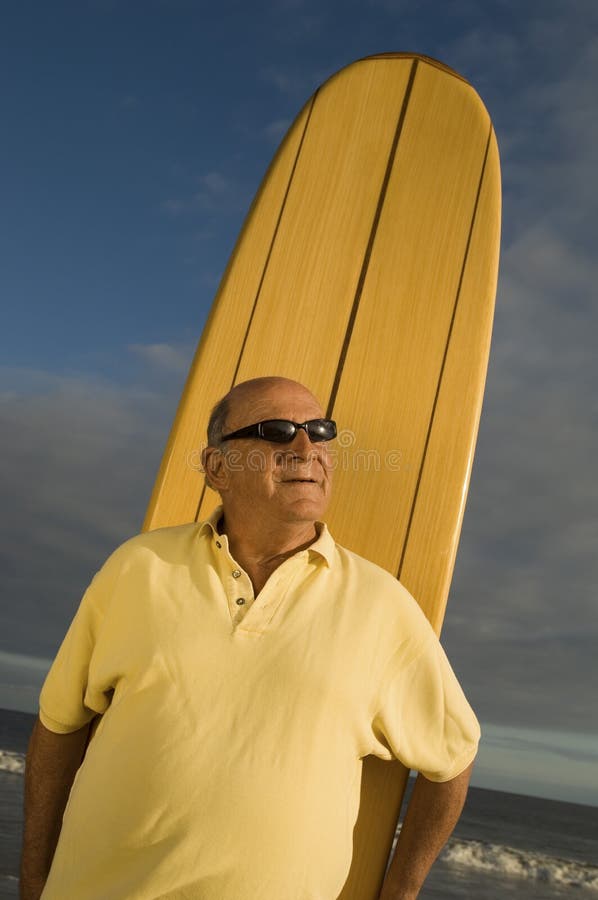 Senior Man with Surfboard stock image. Image of male - 29647573