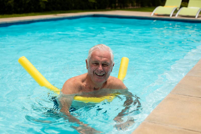Senior Man Swimming with Inflatable Tube Stock Image - Image of ...
