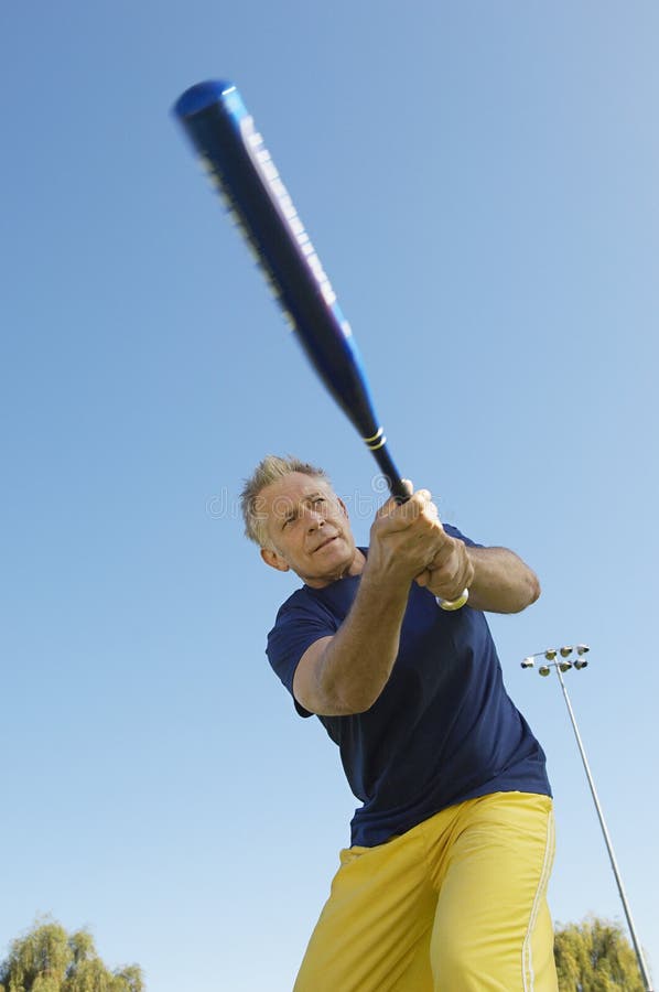 Man Swinging a Baseball Bat - Vertical Stock Image - Image of anger ...