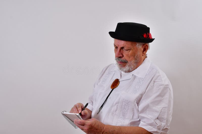Senior Man Taking Notes in His Notebook Stock Photo - Image of amber ...