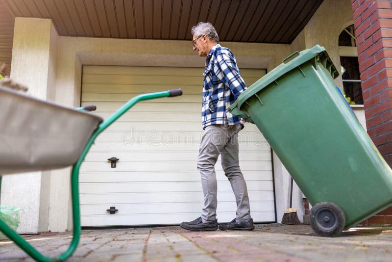 Male Taking Out Garbage Stock Photos - Free & Royalty-Free Stock Photos ...