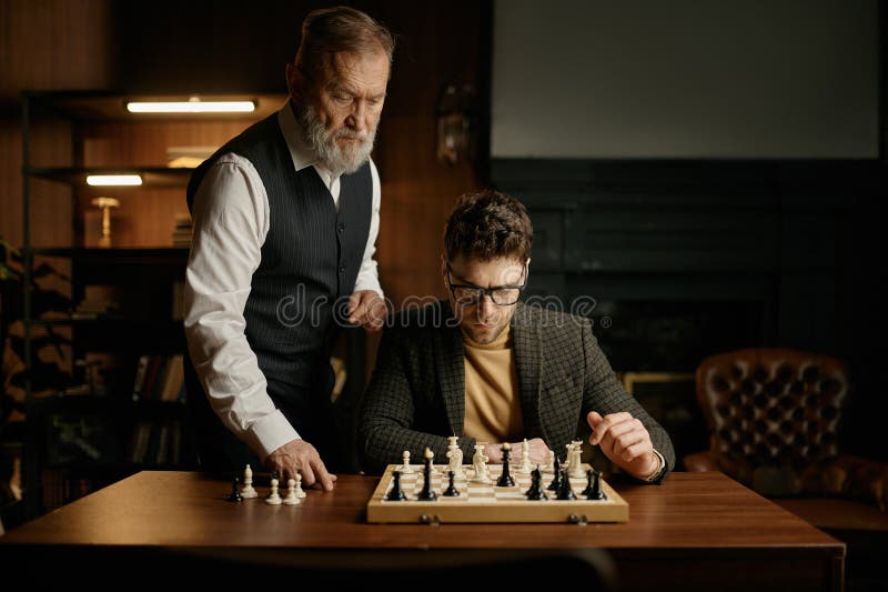 Senior Man Teaching Young Guy Playing Chess Explaining Rules of Game ...