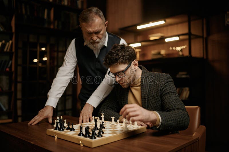 Senior Man Teaching Young Guy Playing Chess Explaining Rules of Game ...