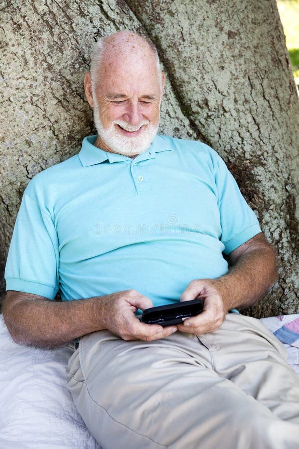 Senior Man Text Messaging stock image. Image of isolated - 9933289