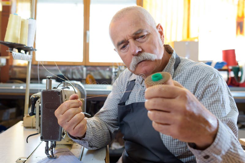 Senior Man Threading Old Fashioned Manual Sewing Machine Stock Image ...