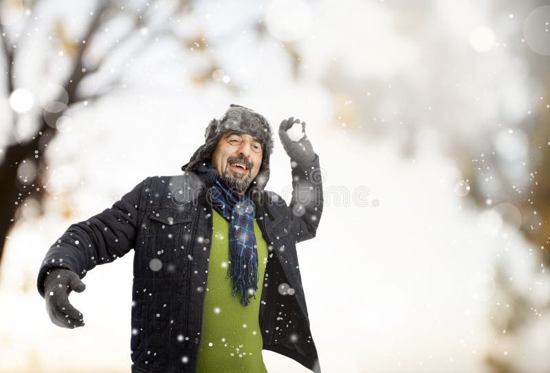 A Senior Man Throwing A Snowball Stock Image - Image of beard, coat ...