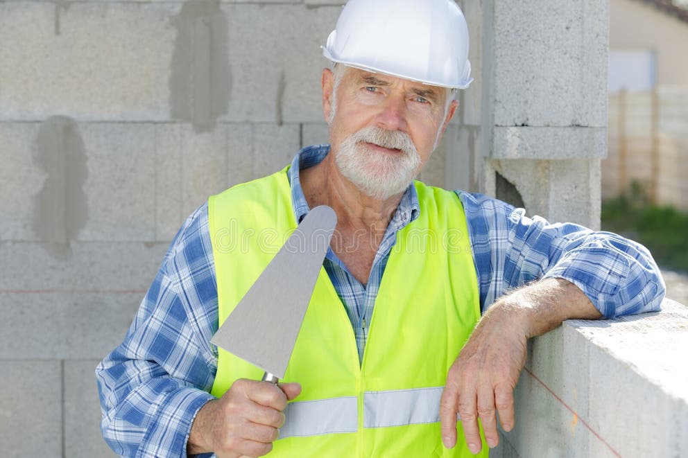 Senior man tiling wall stock image. Image of handyman - 317246603