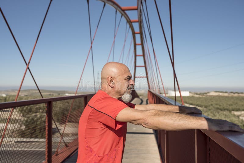 Senior Man Training and Stretching on Bridge Stock Image - Image of ...