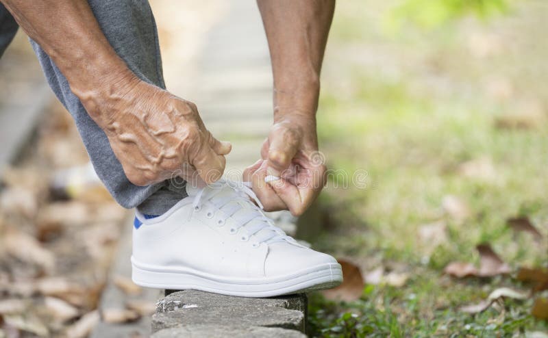 Senior Man Tying Shoelace Getting Ready for Exercise Stock Photo ...