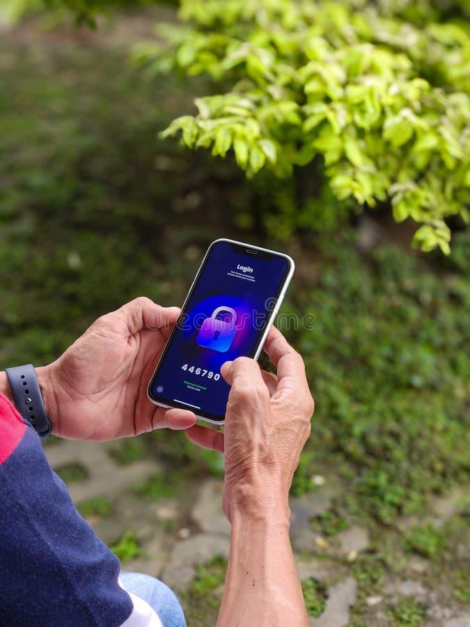 Senior Man Unlocks Phone with Passcode for Security Outdoors Stock ...