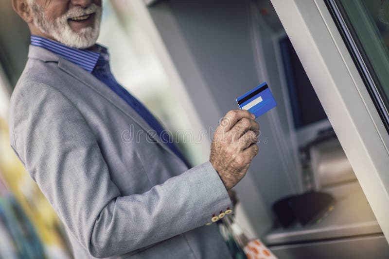 Senior Man Using ATM Machine with Credit Card Stock Image - Image of ...