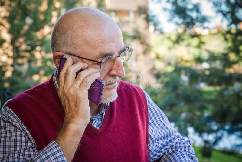 Senior Man Using Cell Phone Stock Image - Image of call, park: 61917773