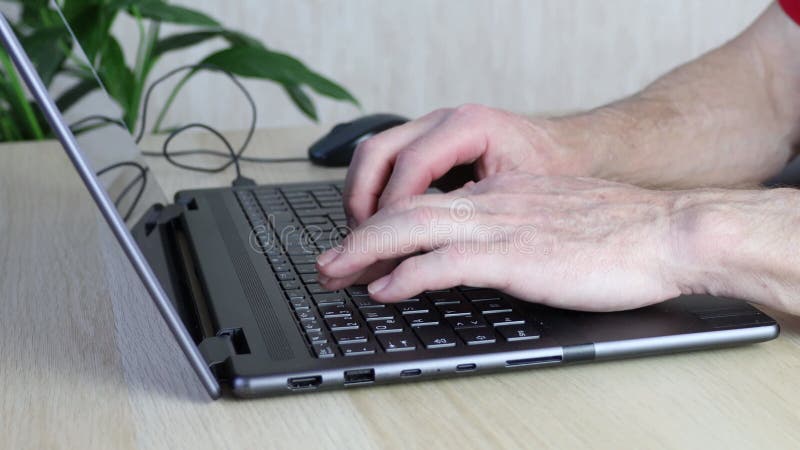 Senior Man Using Computer. Hands Typing on Laptop Keyboard. Stock ...