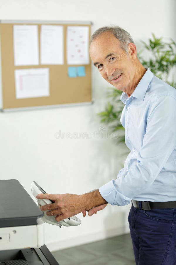 Senior Man Using Digital Photocopier Machine Stock Photo - Image of ...