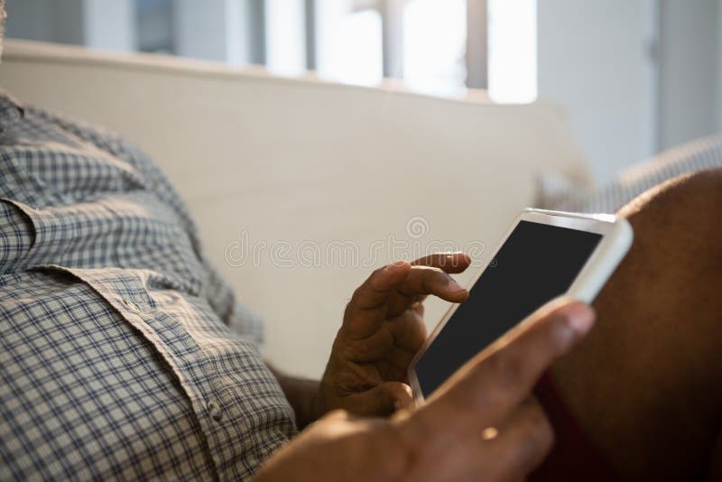 Senior Man Using Digital Tablet in the Living Room at Home Stock Image ...