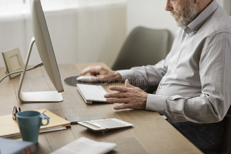 Senior Man Using His Computer at Home Stock Image - Image of ...