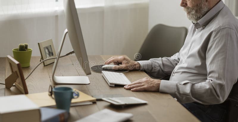 Senior Man Using His Computer at Home Stock Photo - Image of browsing ...