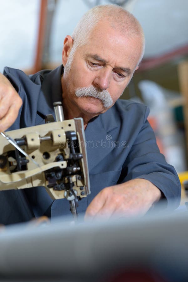 Senior Man Using Industrial Sewing Machine Stock Image - Image of ...