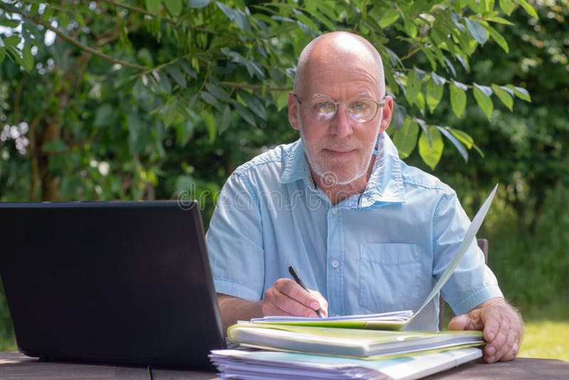 Senior Man Using Laptop in the Garden Stock Image - Image of laptop ...