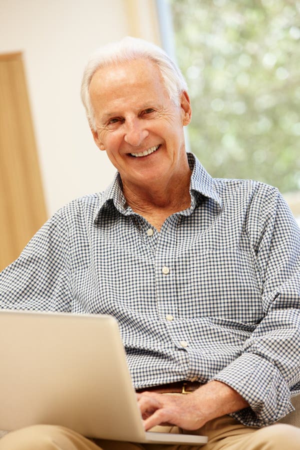 Senior Man Using Laptop at Home Stock Photo - Image of business, adult ...