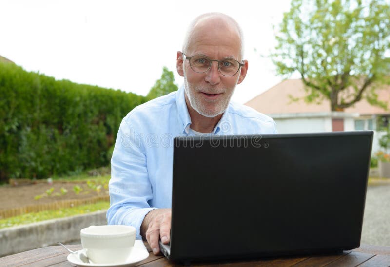 Senior Man Using a Laptop Outside Stock Image - Image of older ...
