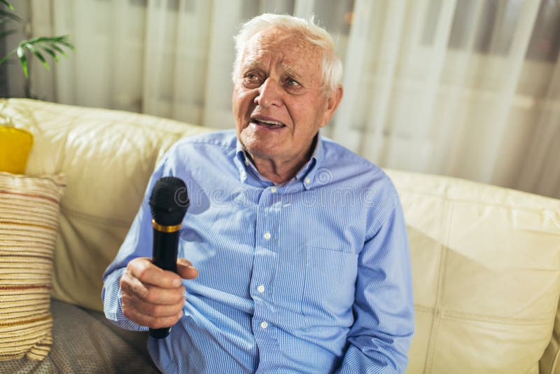 Senior Man Using Microphone and Singing Karaoke Stock Image - Image of ...