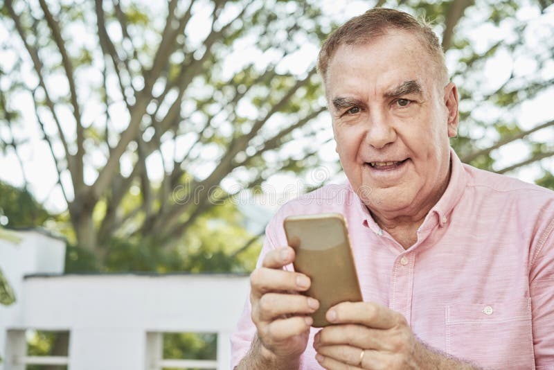 Senior Man Using Mobile App Stock Photo - Image of message, looking ...