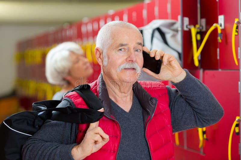 Senior Man Using Smartphone in Leisure-center Locker Room Stock Image ...