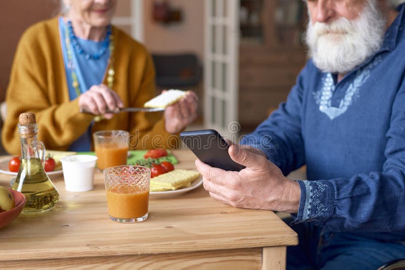 Senior Man Using Smartphone for Lunch Stock Photo - Image of food ...