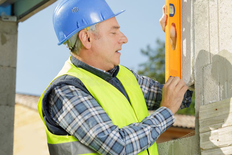 Senior Man Using Spirit Level on Wall Stock Image - Image of home ...