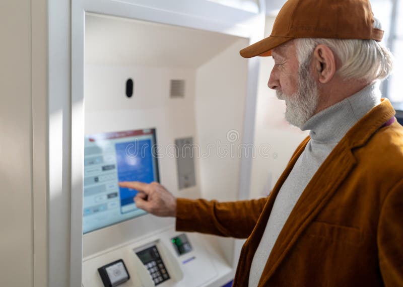 Senior Man Using Ticket Machine on Train Station Stock Image - Image of ...