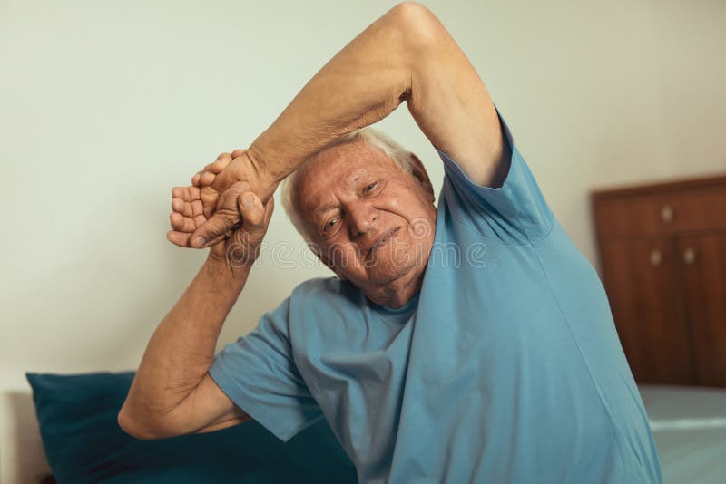 Senior Man Waking Up and Stretching Stock Image - Image of morning ...