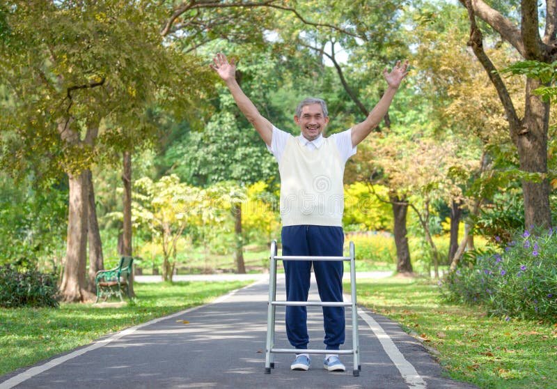 Senior Man with Walker Raising Hands Gesturing Happiness while Practice ...