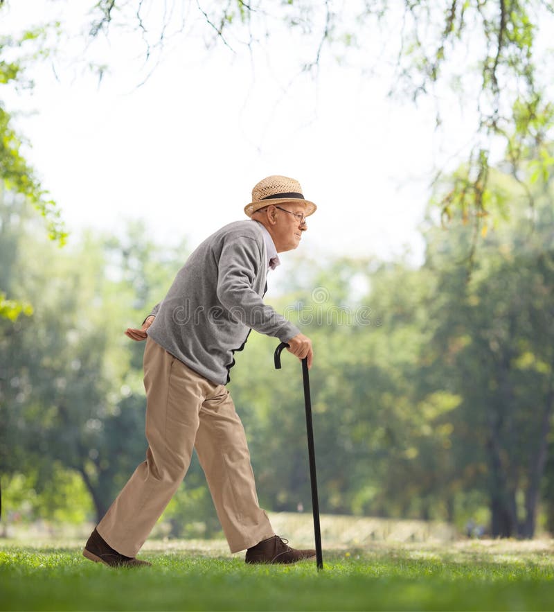 Senior Man Walking with a Cane in a Park Stock Photo - Image of nature ...